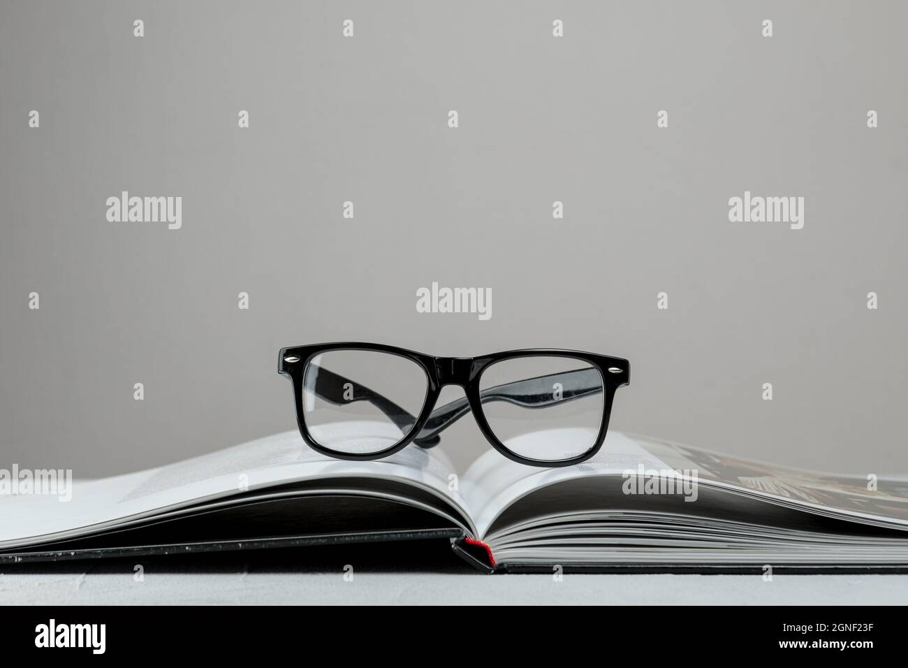 front view open book with glasses. High quality and resolution ...
