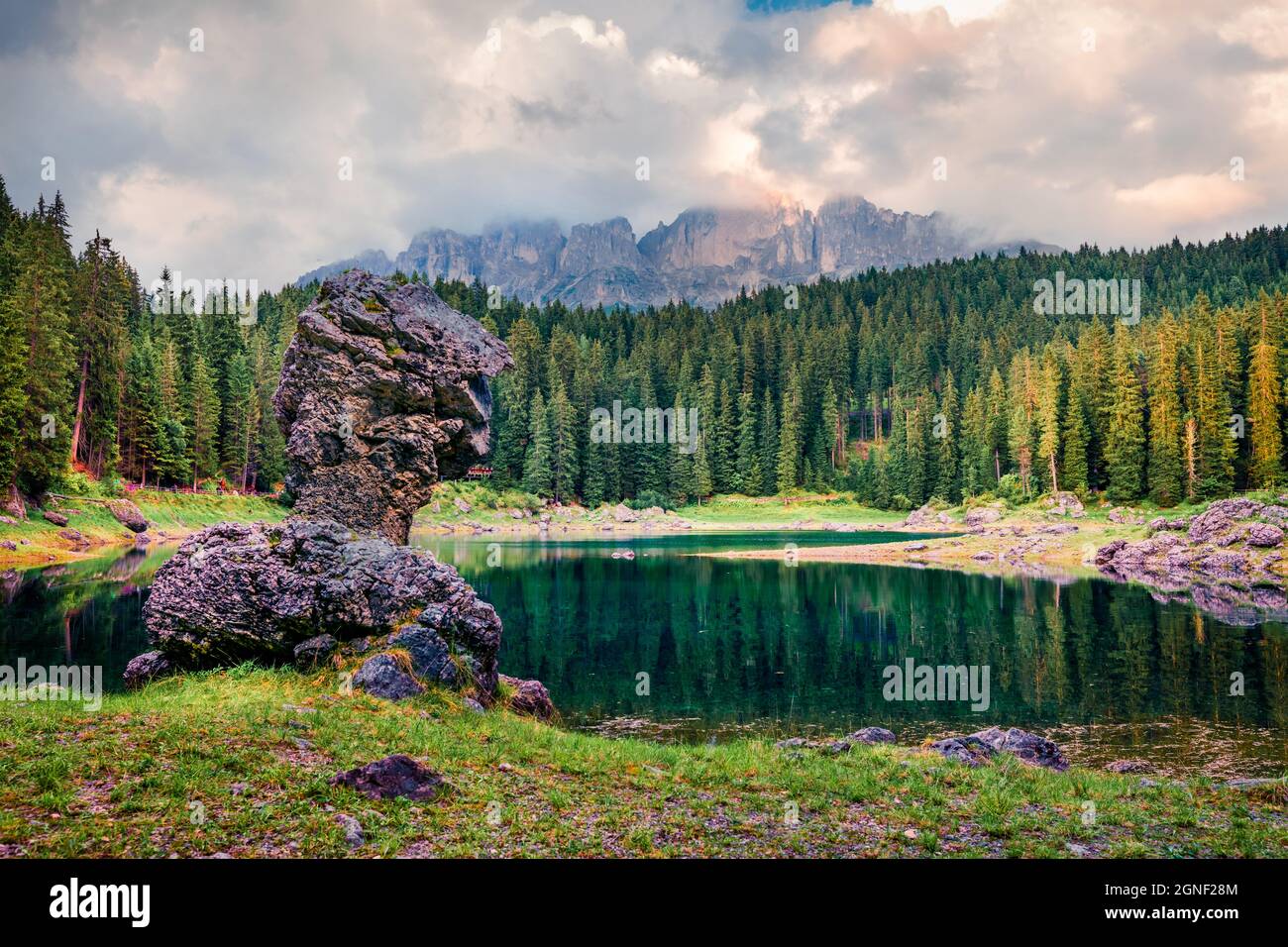 Amazing summer view of Carezza (Karersee) lake. Calm morning scene of ...