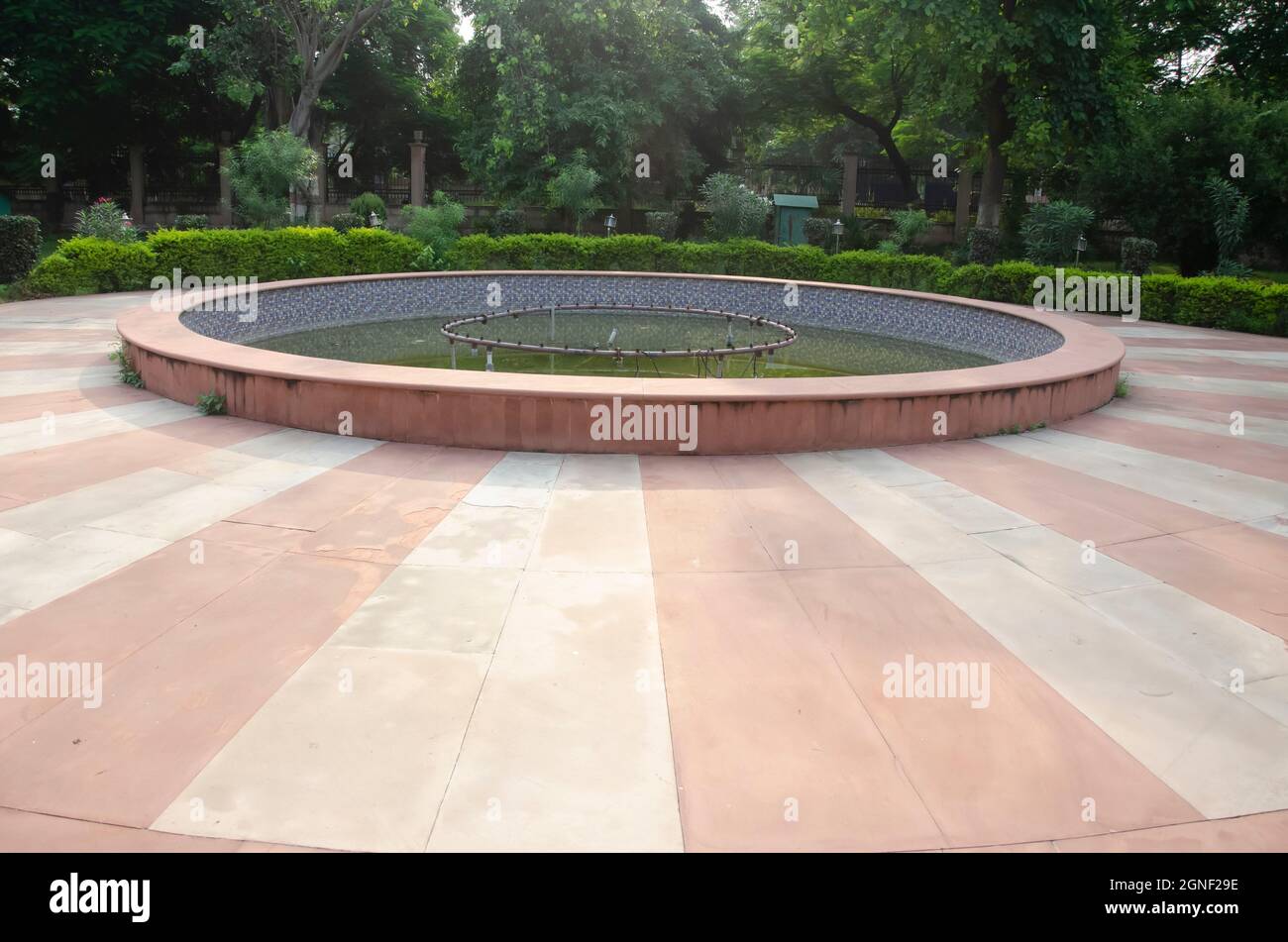 Rounded fountain concrete structure in the park Stock Photo - Alamy