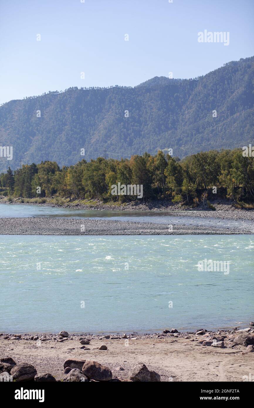 A fast-flowing wide and full-flowing mountain river Stock Photo - Alamy