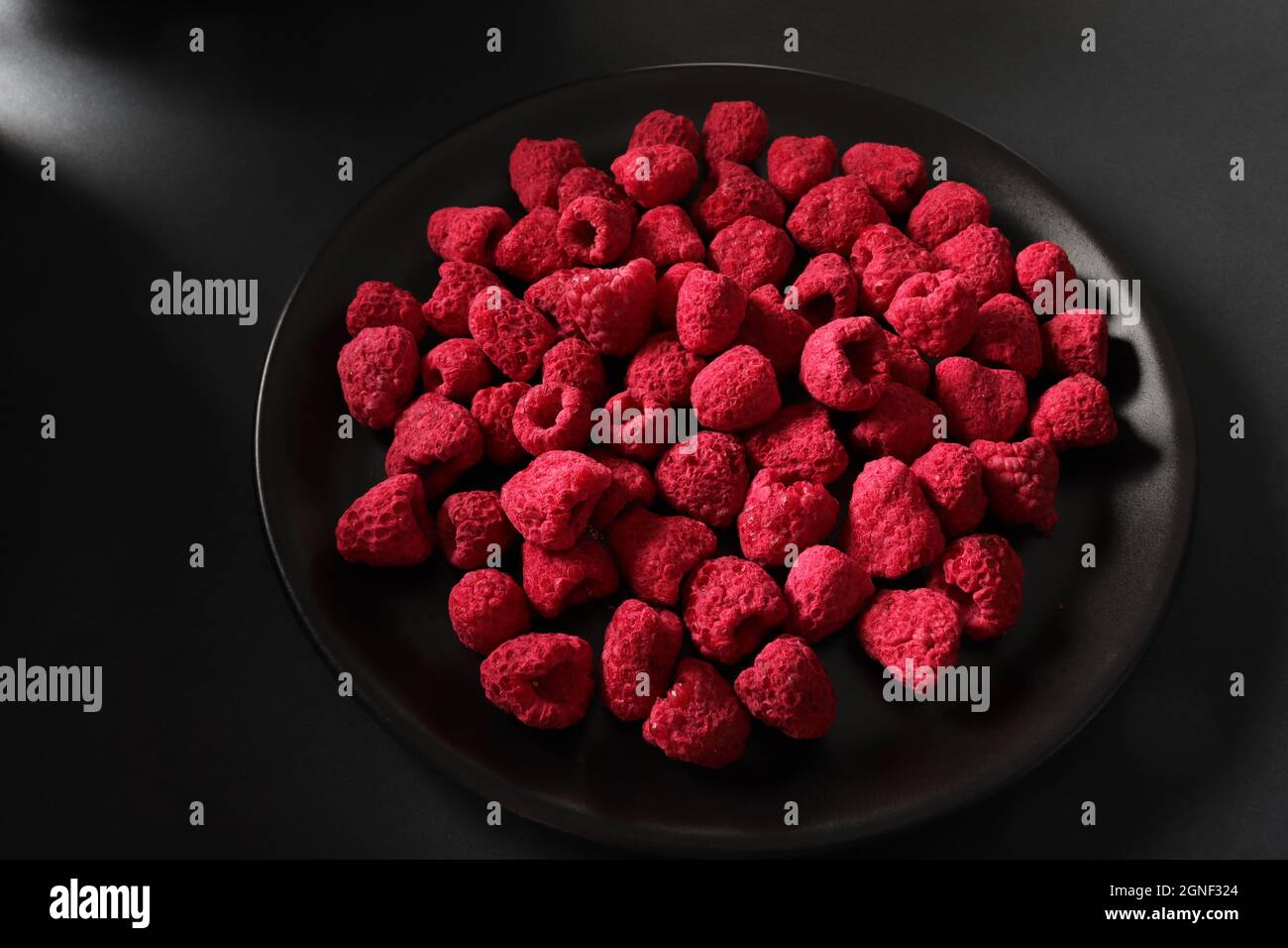 freeze dried raspberries on plate Stock Photo - Alamy