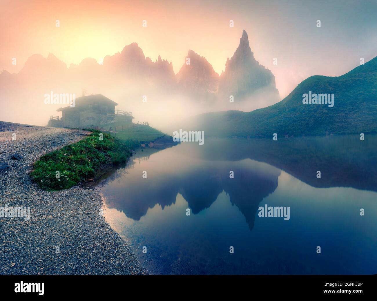 Impressive morning view of Baita Segantini mountain refuge with Cimon ...