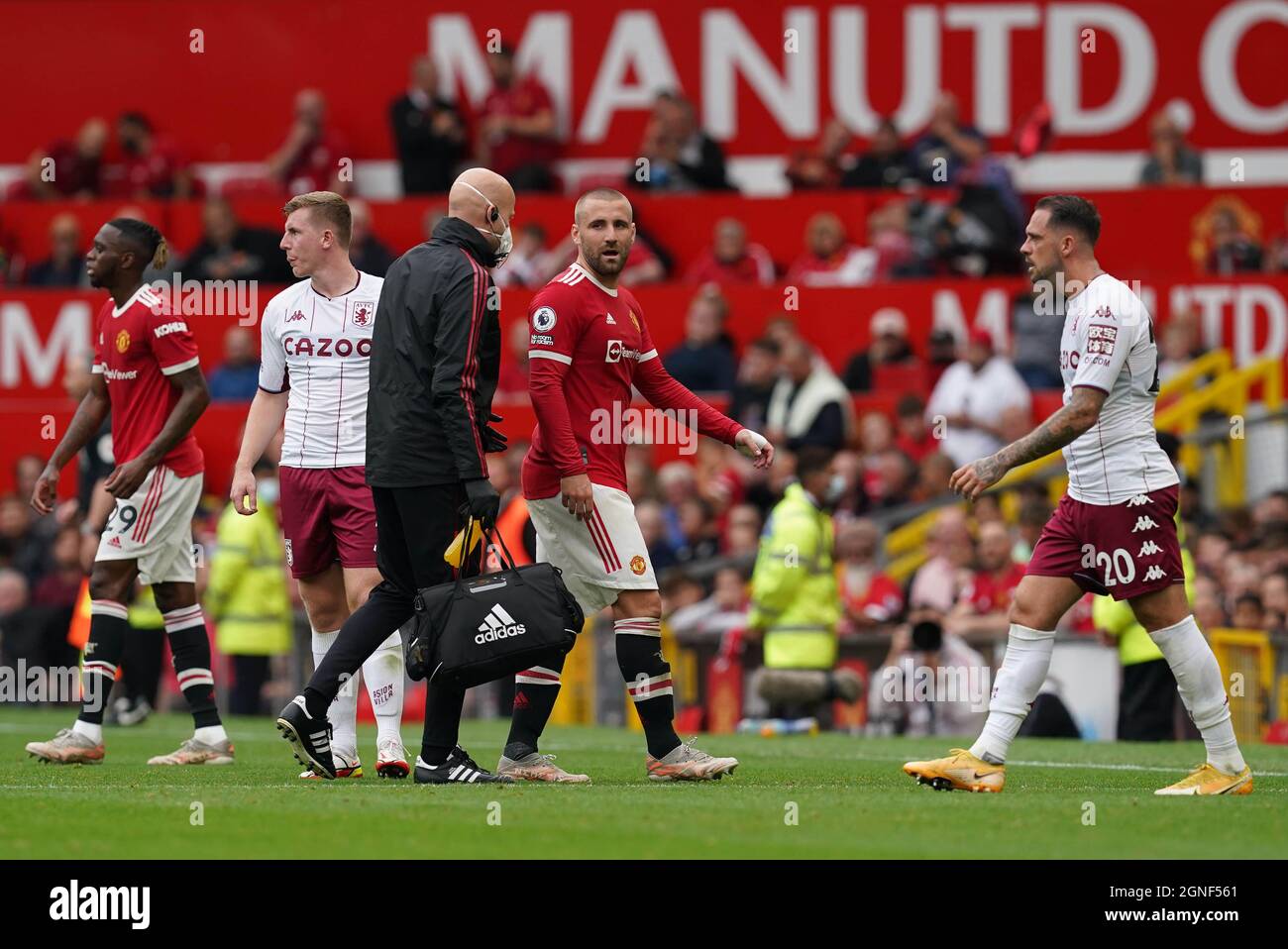Manchester United's Luke Shaw (centre) makes his way off the pitch ...