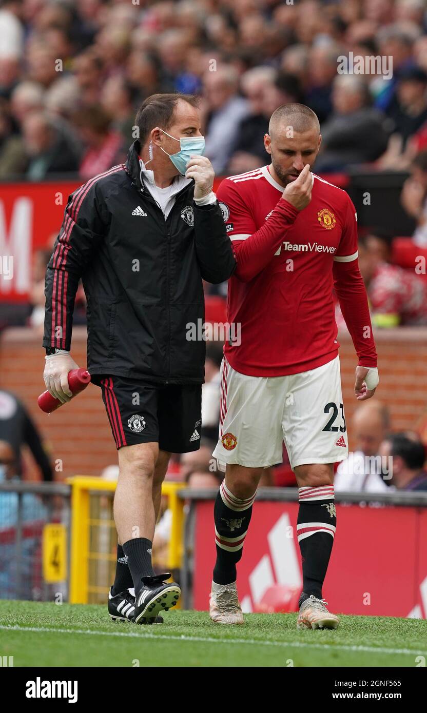 Manchester United's Luke Shaw (right) makes his way off the pitch after ...