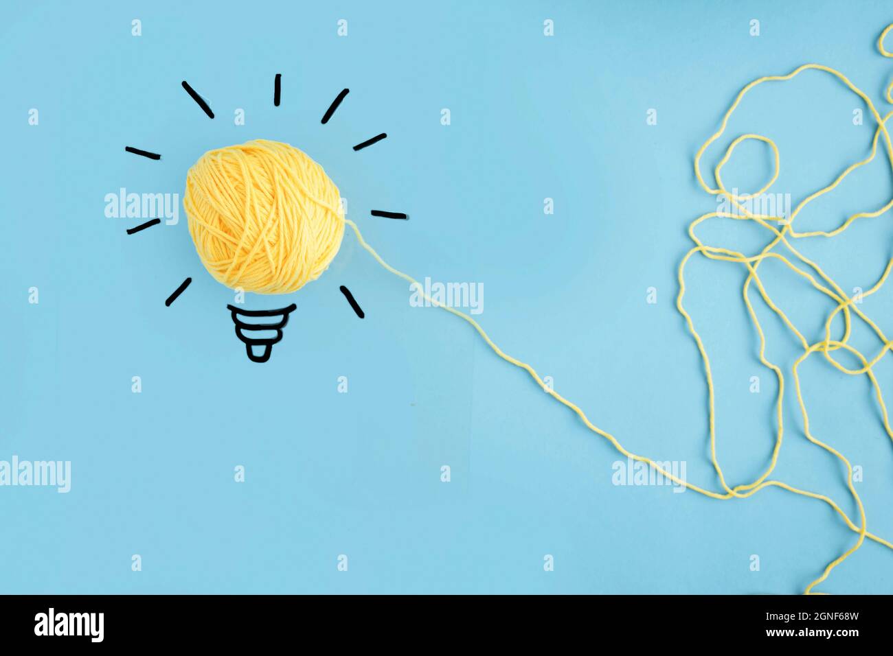 illuminated yarn yellow light bulb blue background. High quality and ...