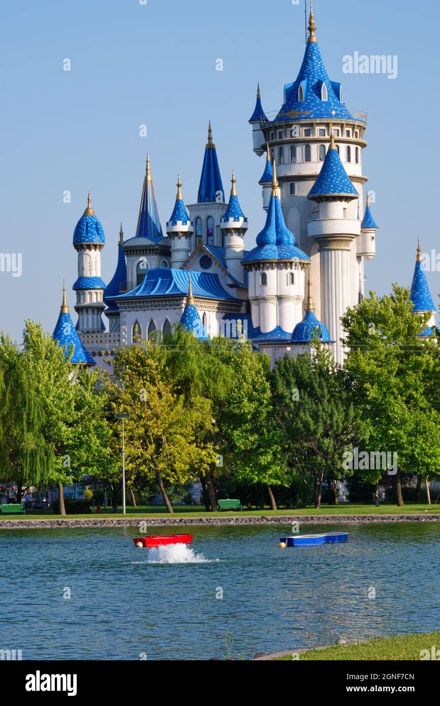 Vintage Nostalgic Castle with blue towers at lakeside Stock Photo - Alamy