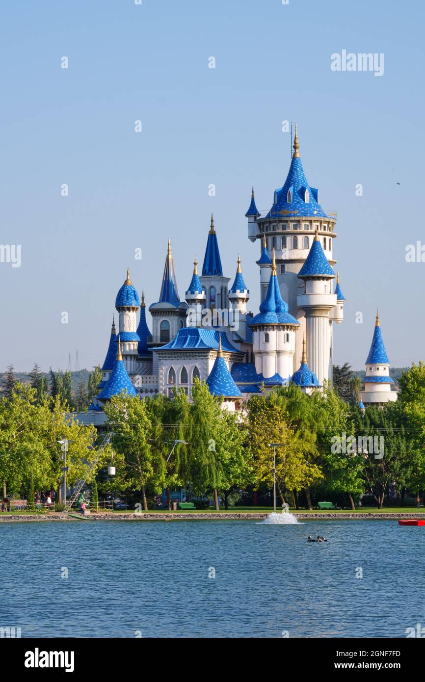 Vintage Nostalgic Castle with blue towers at lakeside Stock Photo - Alamy