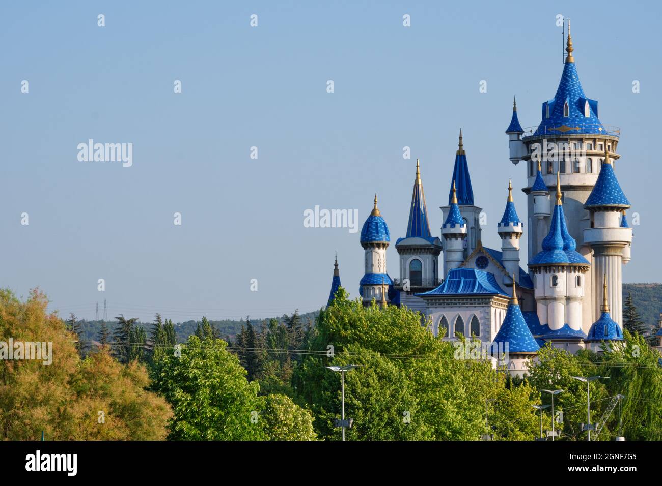 Vintage Nostalgic Castle with blue towers at lakeside Stock Photo - Alamy