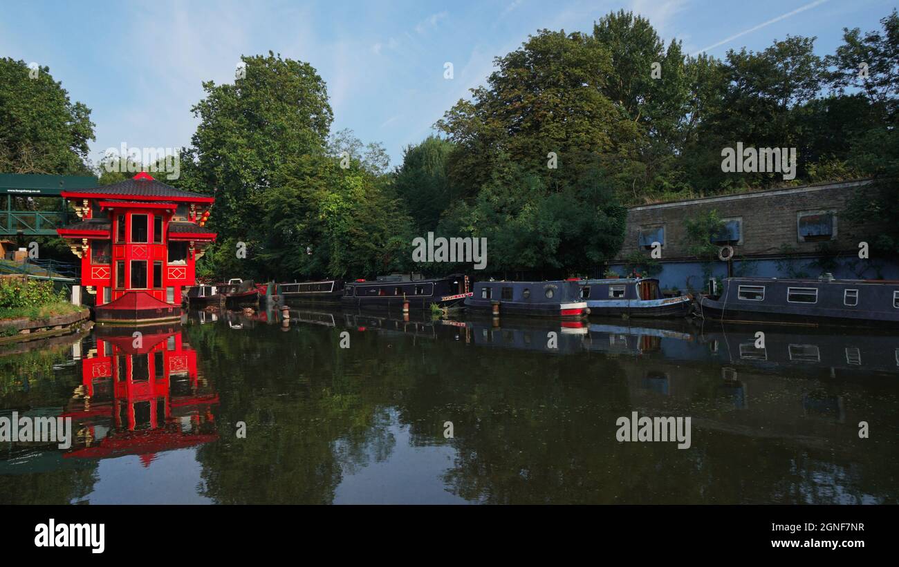 The river Thames in a quiet part of Camden with various boats, lots of ...