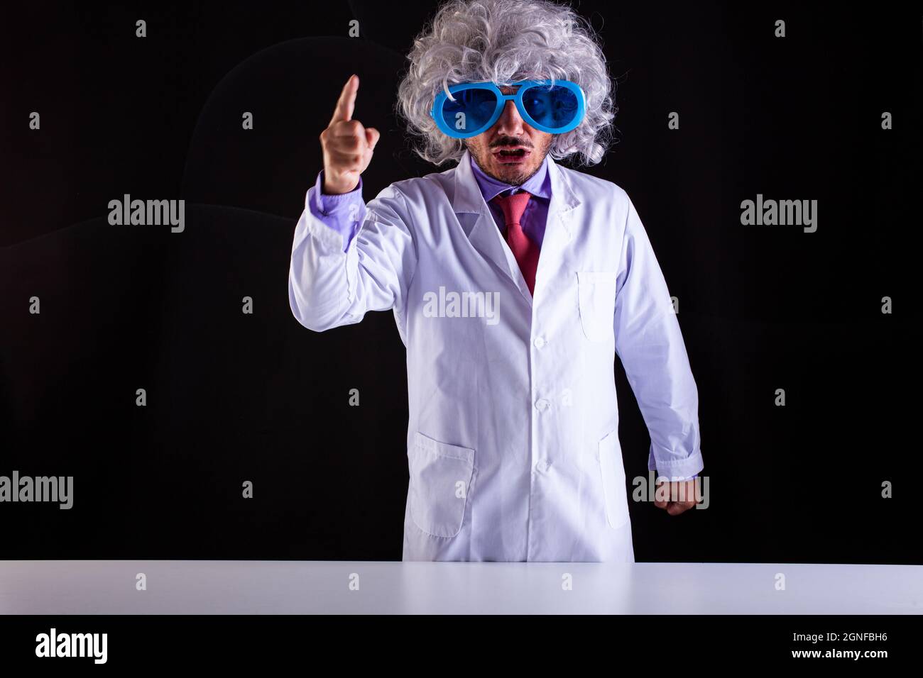 Angry science teacher in white coat with unkempt hair in funny eye ...