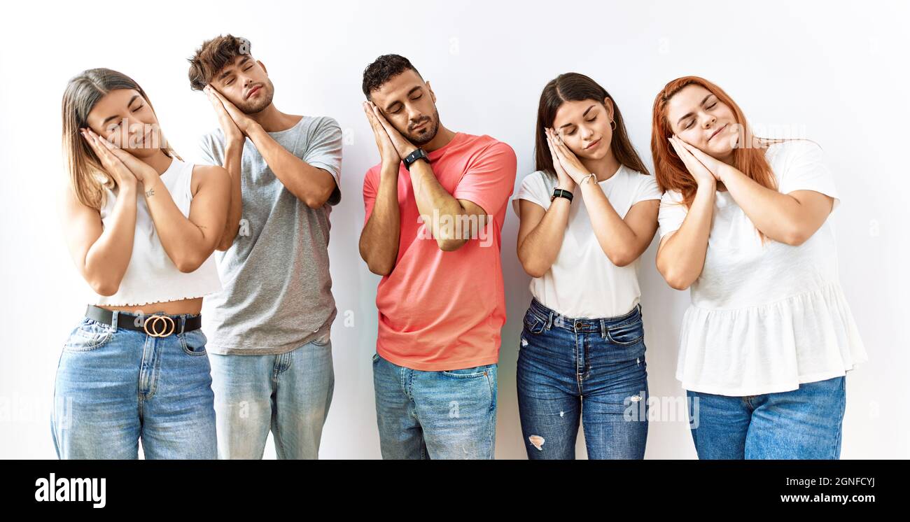 Group of young friends standing together over isolated background ...