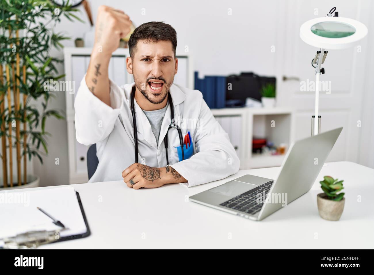 Angry male doctor computer hi-res stock photography and images - Alamy
