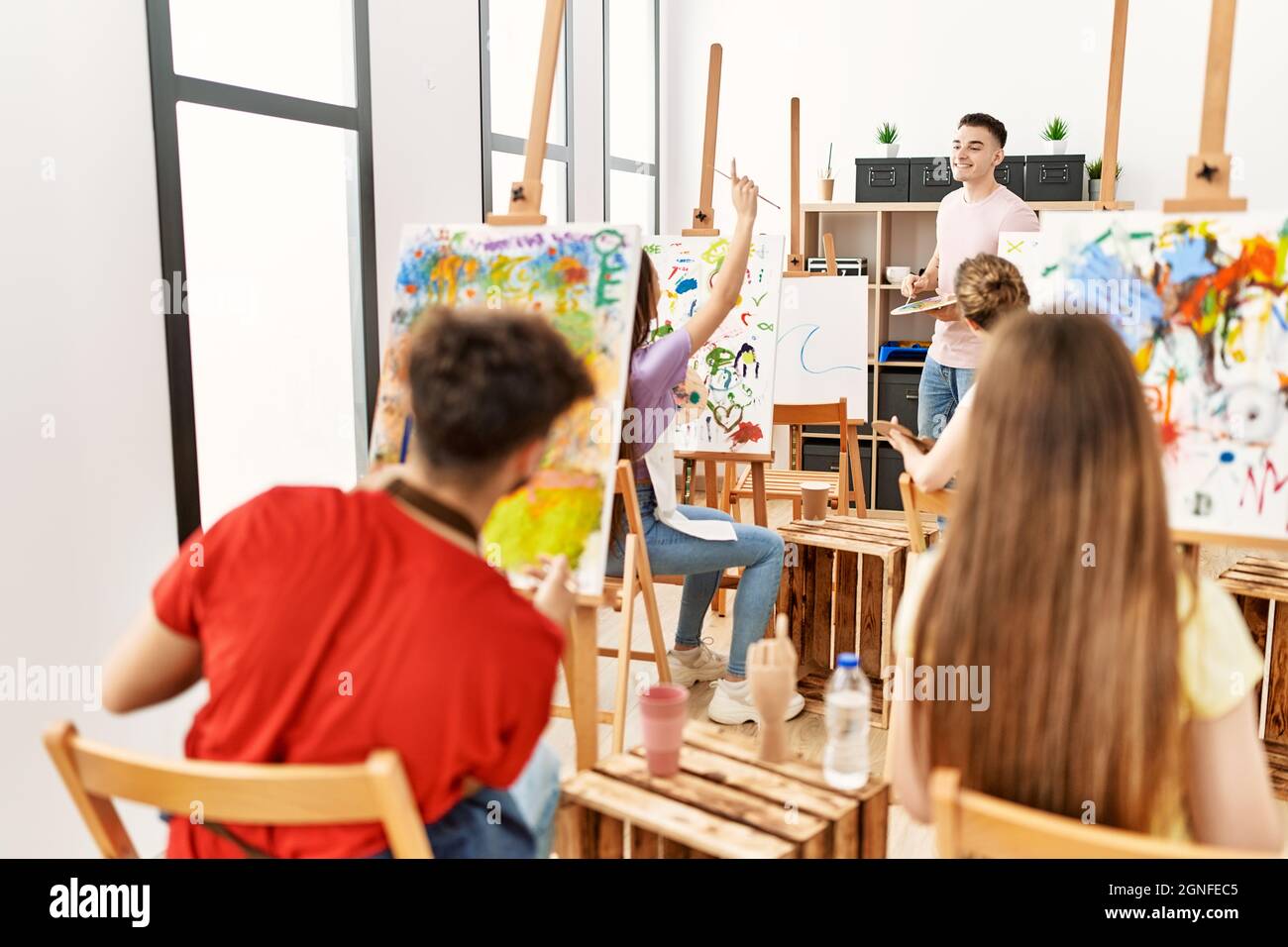 Group of people smiling happy having paint class at art studio Stock ...