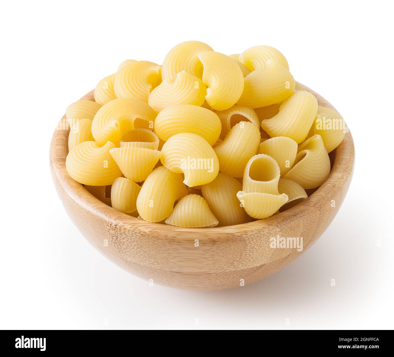 Uncooked pipe rigate pasta in wooden bowl isolated on white background ...