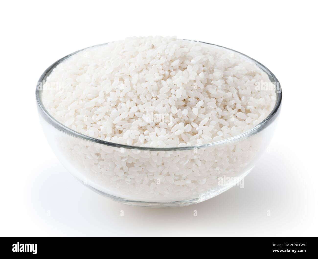 Uncooked round rice in glass bowl isolated on white background with ...