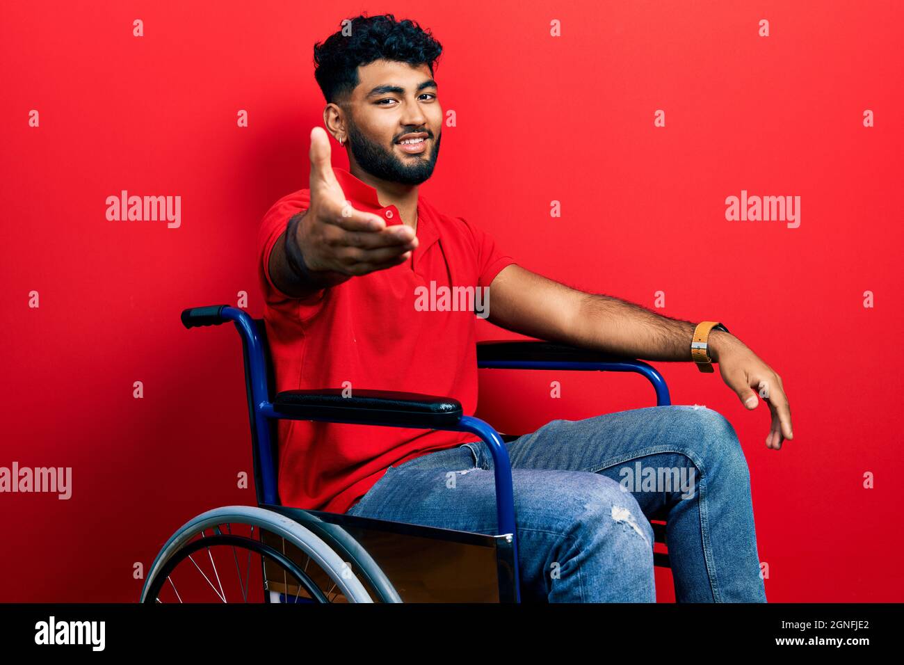 Helping disabled wheelchair middle east hi-res stock photography and ...