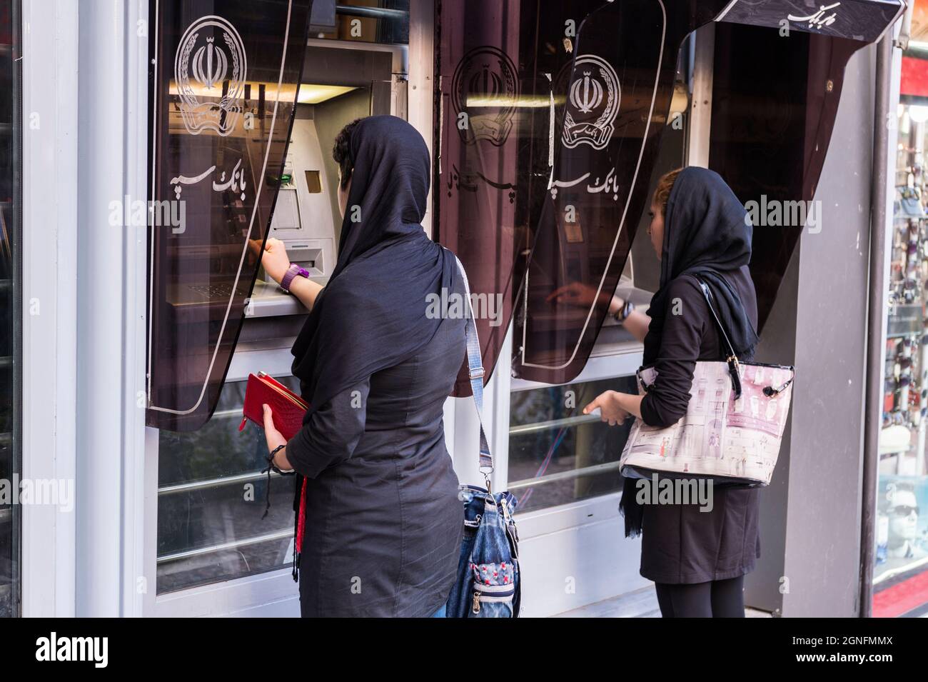 IRAN. TEHRAN. ATM MACHINE. IRANIAN WOMAN OF TEHRAN WHO TRIES TO ...