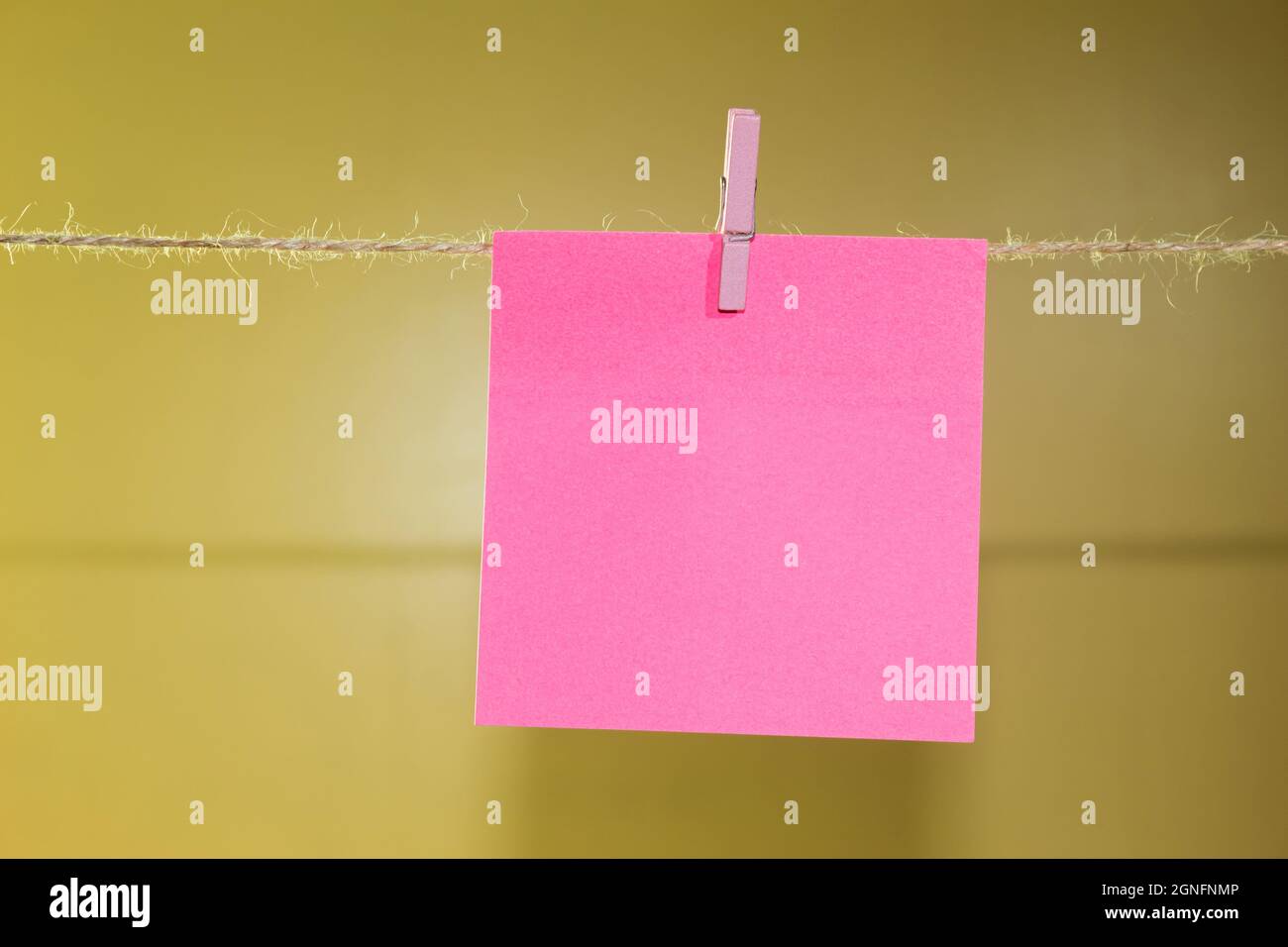 The paper for the text is suspended from a rope. Photo frames hanging ...