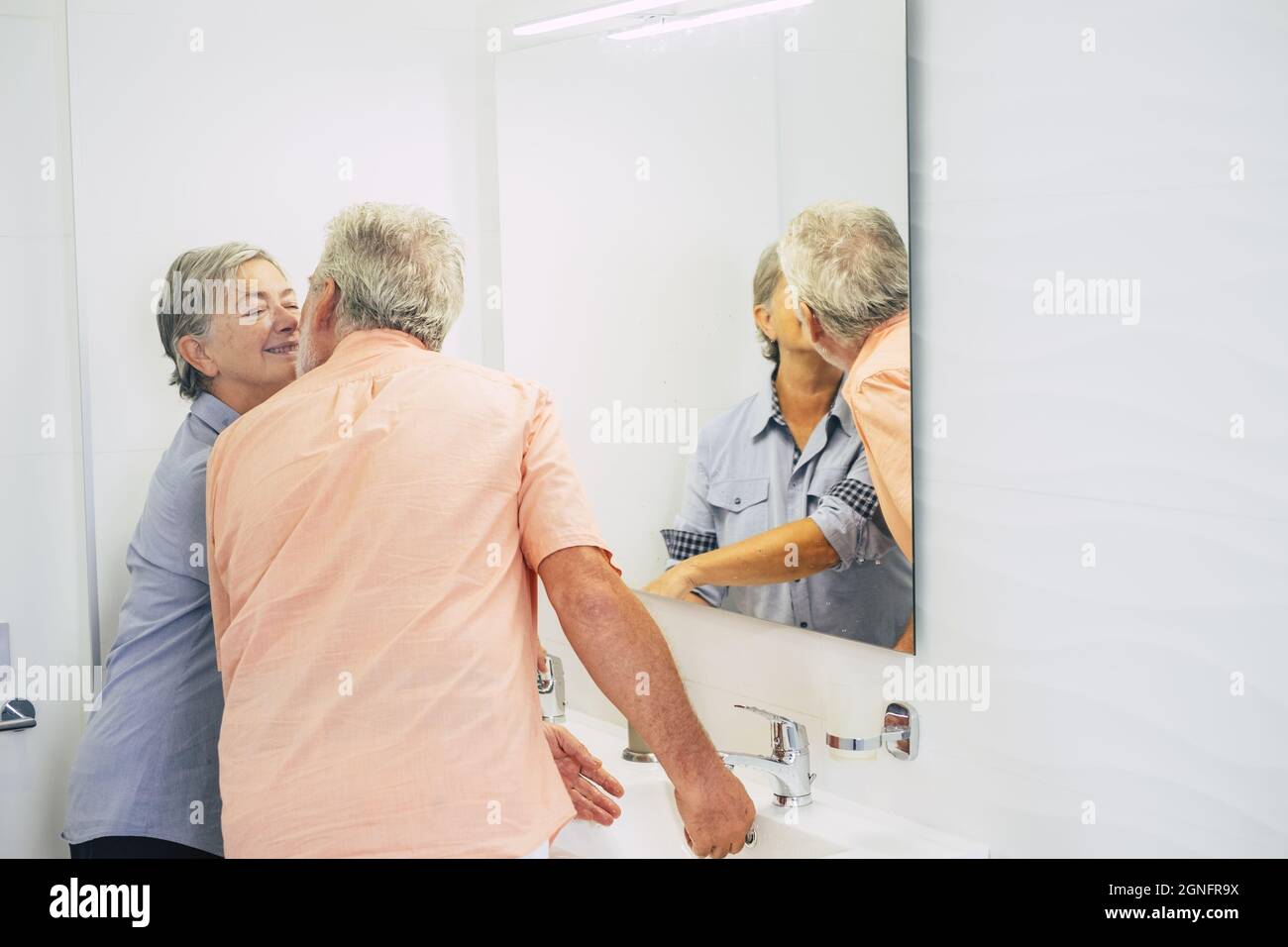 Man kissing woman in bathroom hi-res stock photography and images - Alamy