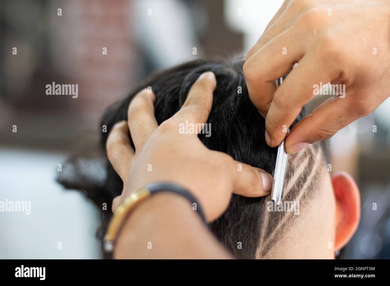 Barber doing Highborn and freestyle by hand. Styling and cut shaving ...