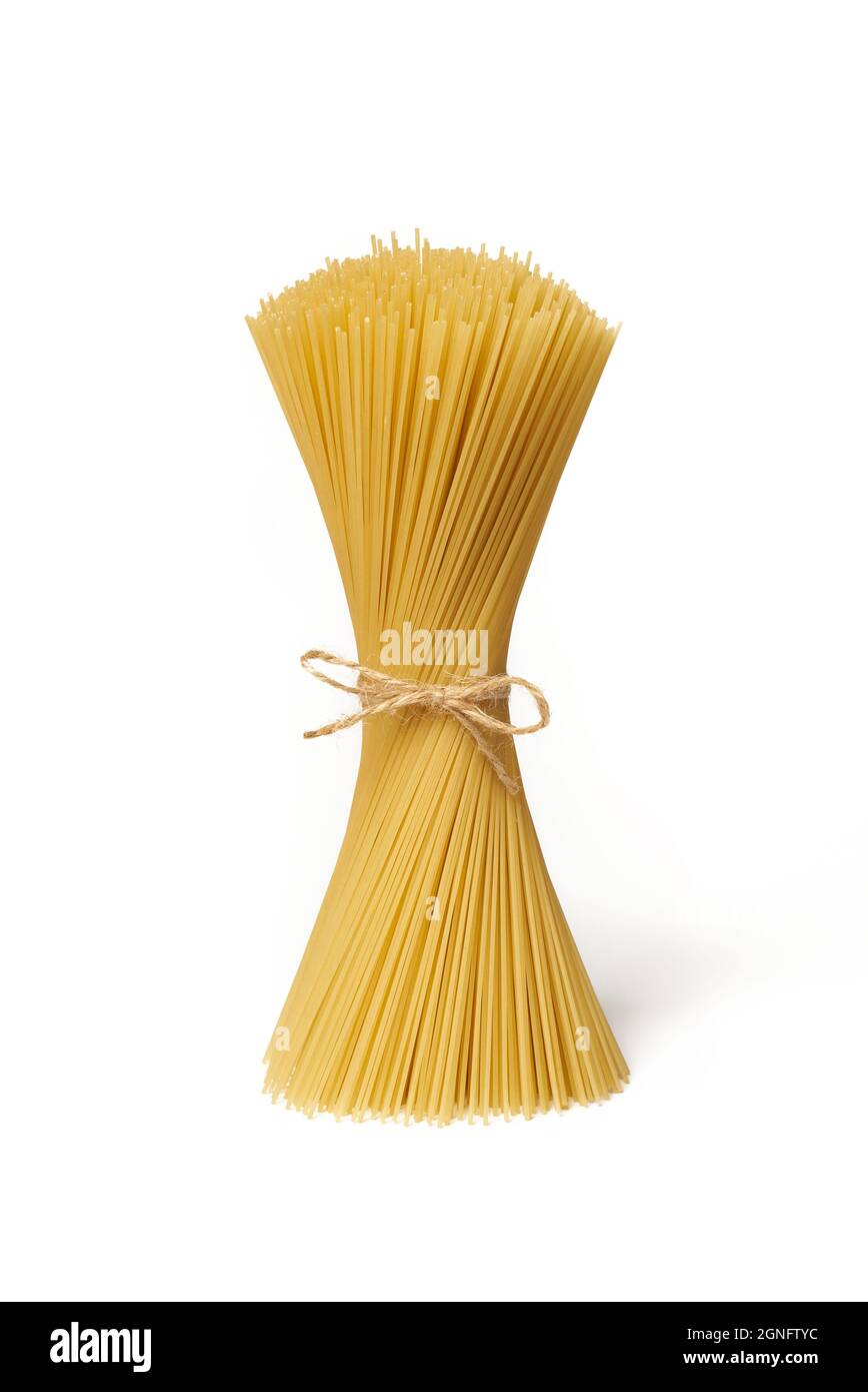Bunch of uncooked spaghetti pasta tied with rope isolated on white ...