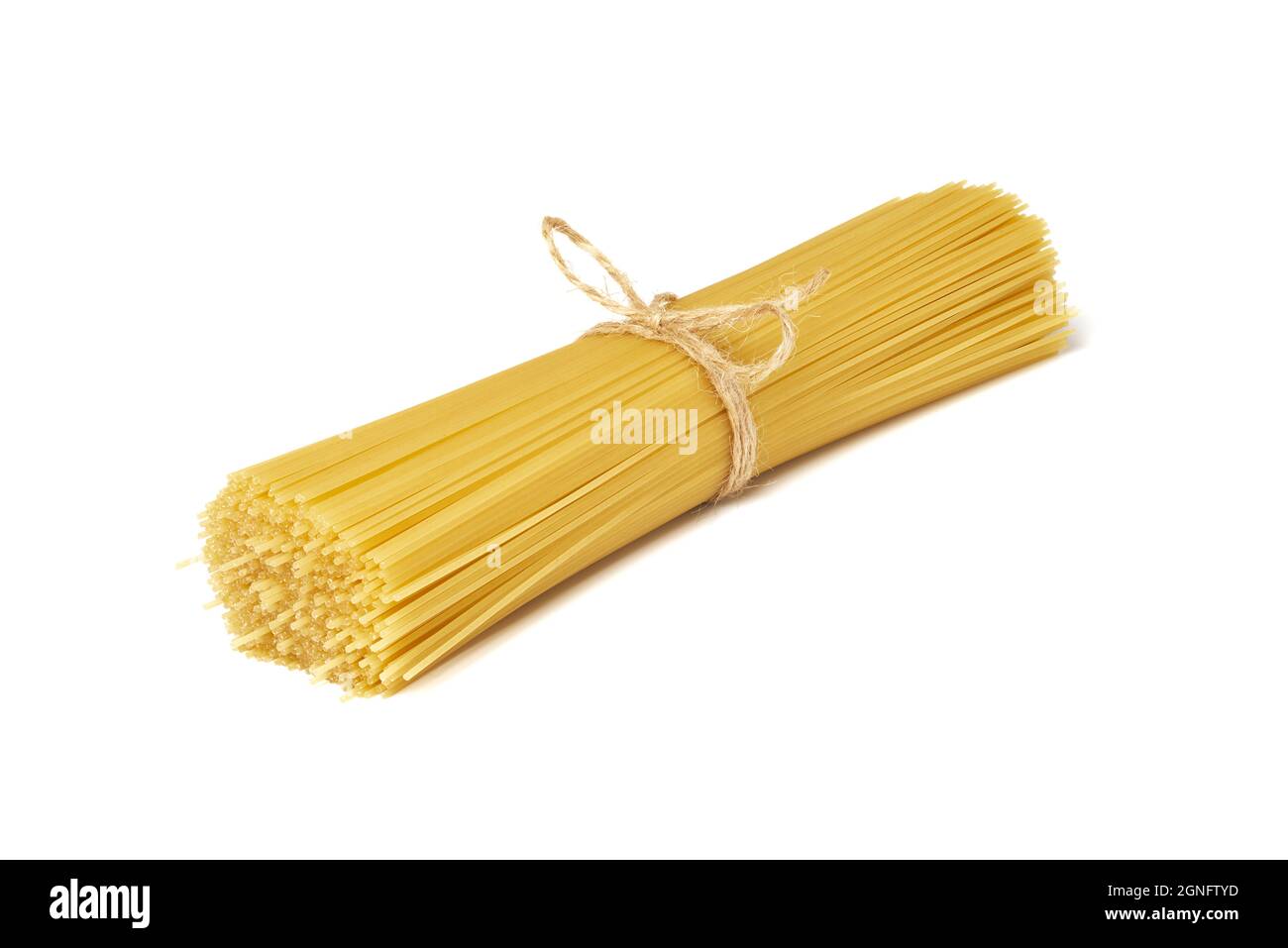 Bunch of raw spaghetti pasta tied with rope isolated on white ...