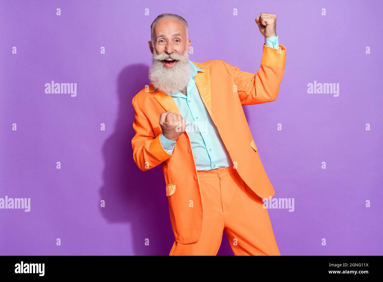 Photo of old cheerful positive happy man raise hands enjoy hooray lucky ...