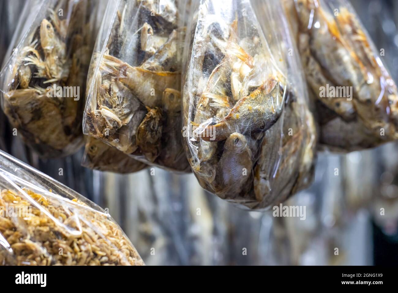 Hanging salted dried sea fishes on a seafood market close up Stock ...