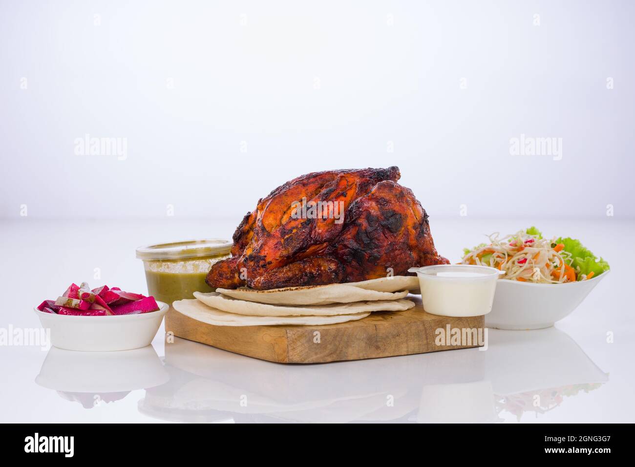 Shawai chicken with kuboose and dips Stock Photo - Alamy