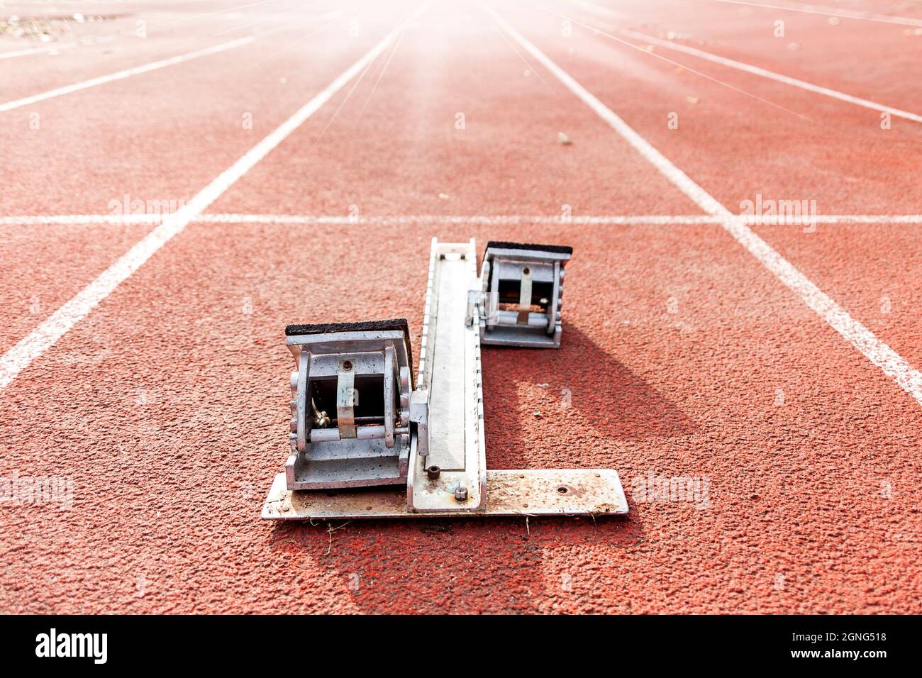 starting blocks on red running tracks Stock Photo - Alamy