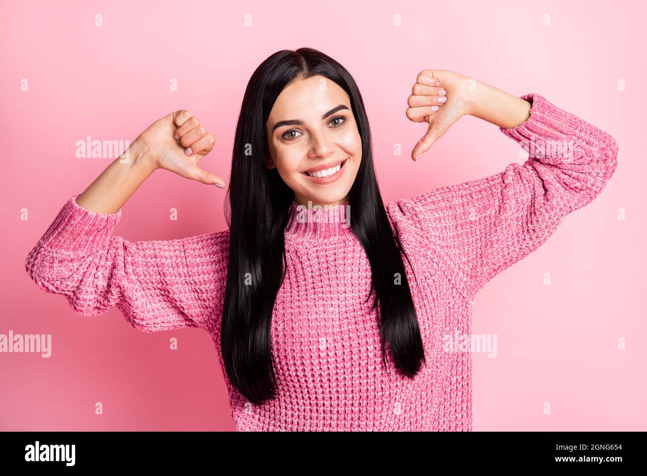 Photo portrait of woman pointing two thumbs at self isolated on pastel ...