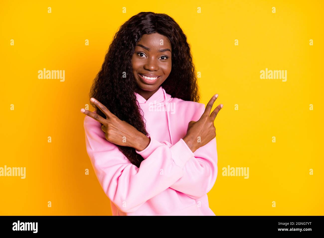 Photo portrait of african american girl showing two v-signs isolated on ...