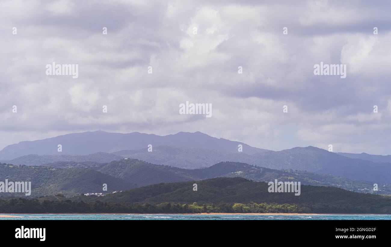 Dark rain clouds hang over the mountains of El Junque Rain Forest in ...