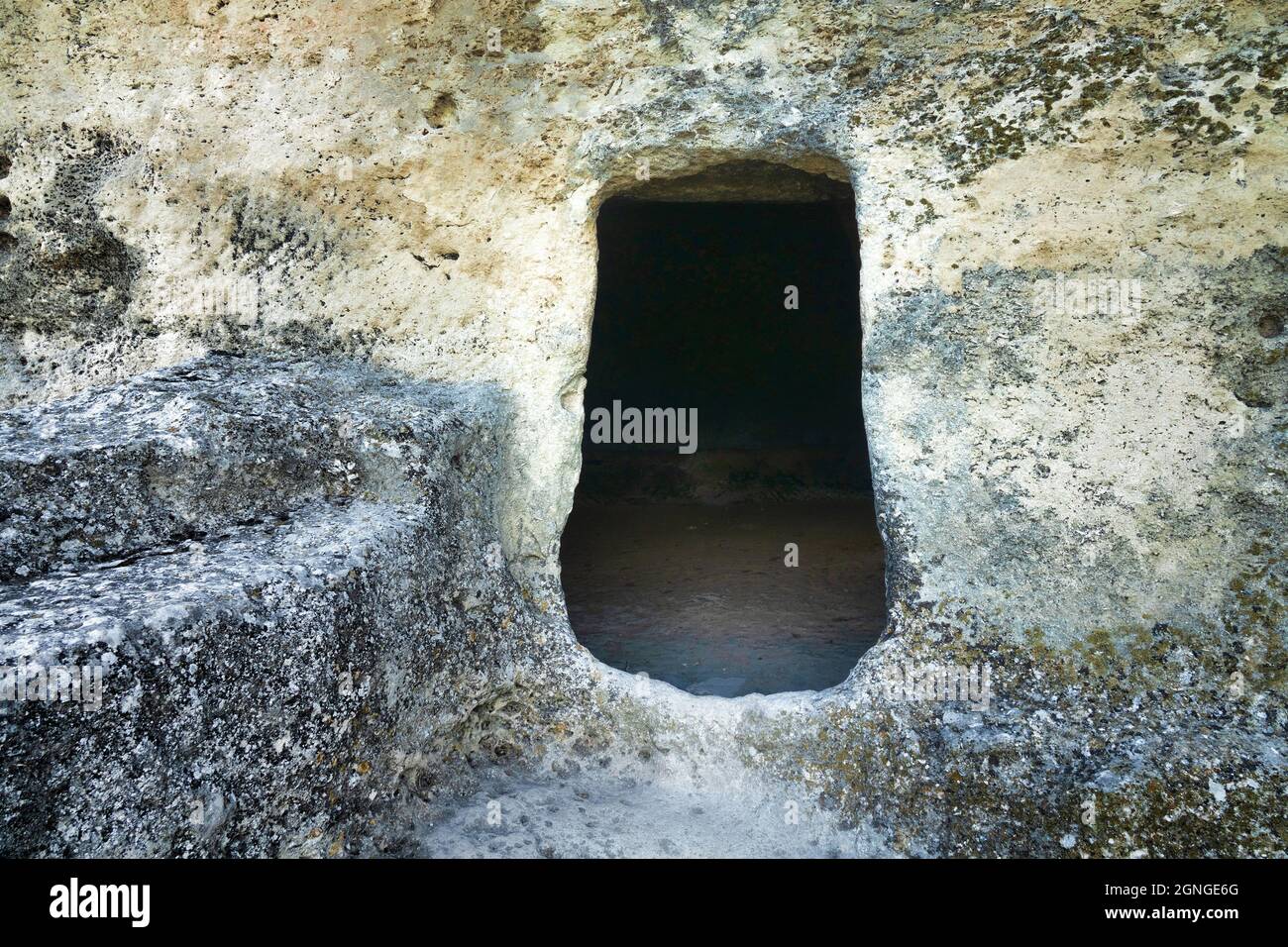 Entrance to a man-made cave in a limestone rock. A place of refuge for ...
