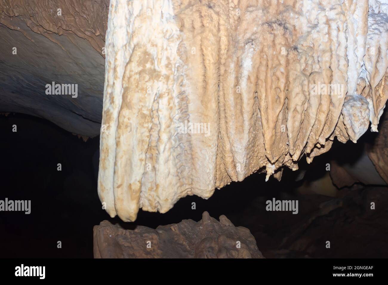 Speleology. Old cave washed by an underground river in the mountain ...