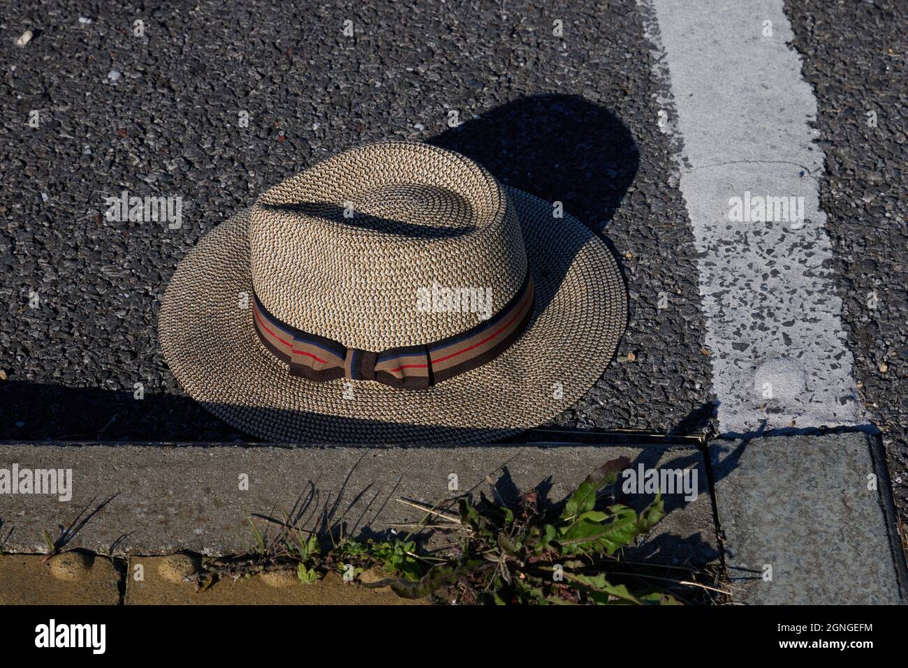 Lost hat seen laying in the street Stock Photo - Alamy
