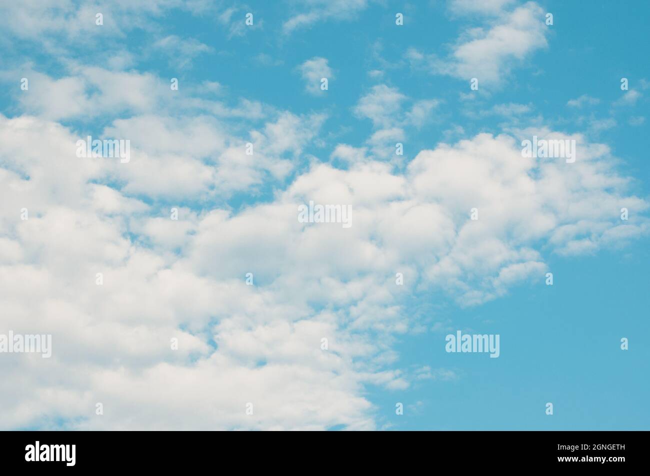 Beautiful curly clouds with turquoise sky background. Sunny weather ...