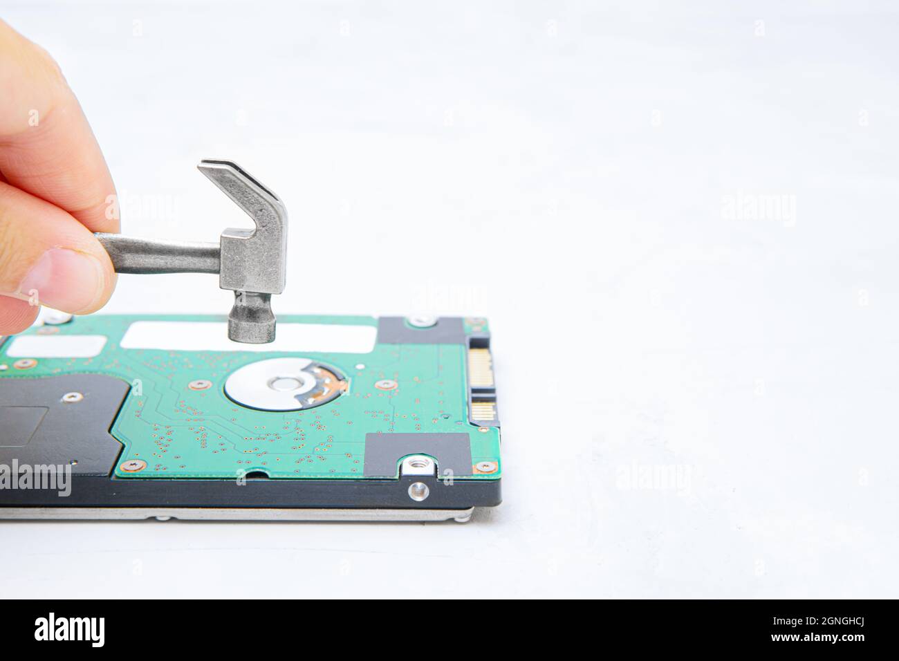 Breaking a hard disk drive with a miniature steel hammer. Extreme data ...