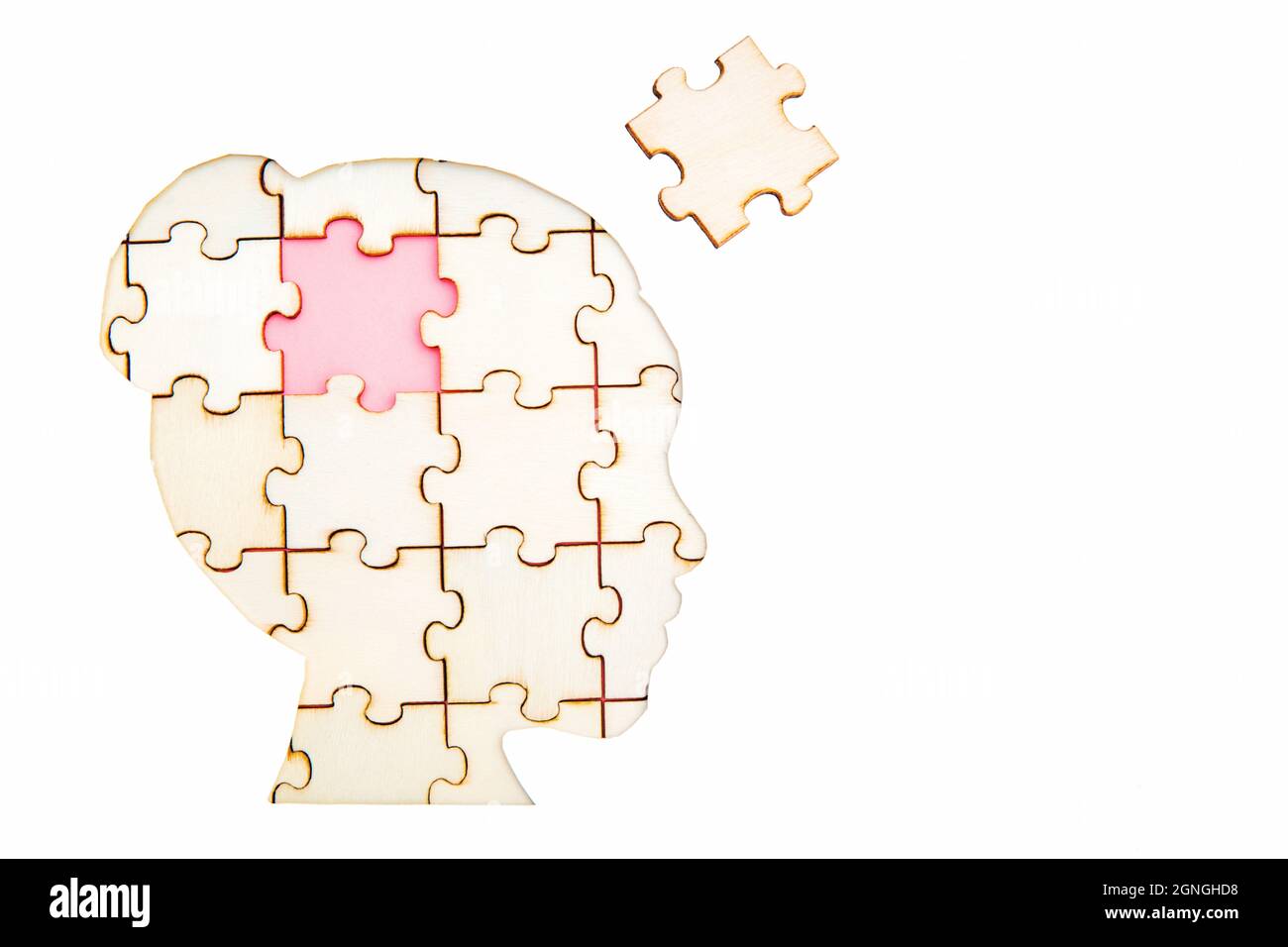 Woman's head profile shaped jigsaw puzzle with the final piece to be ...
