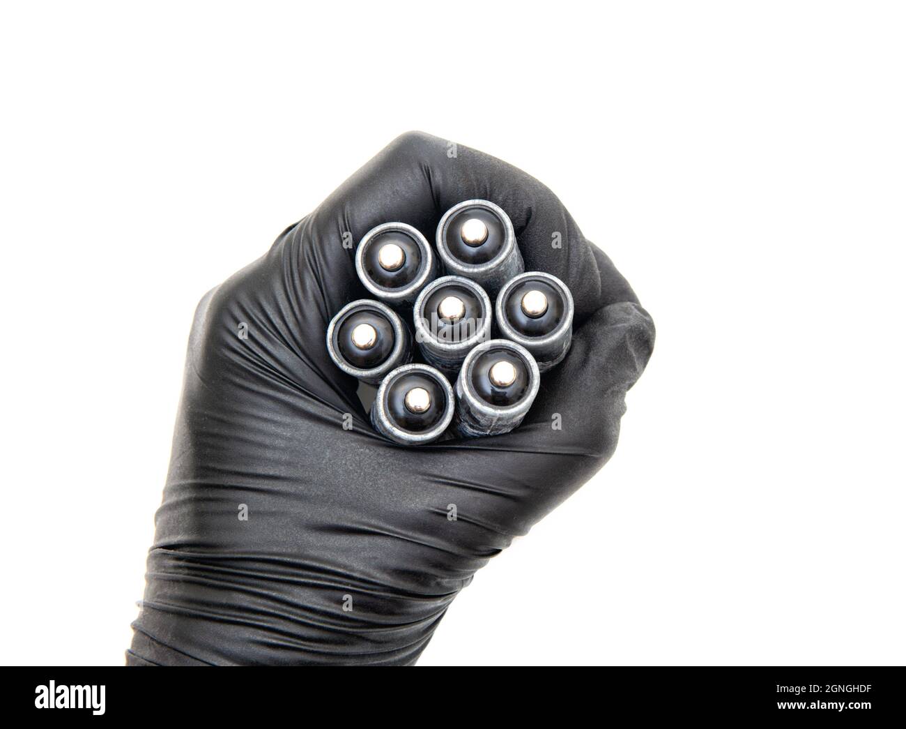 Bunch of corroded AA type batteries in a black gloved hand isolated on ...