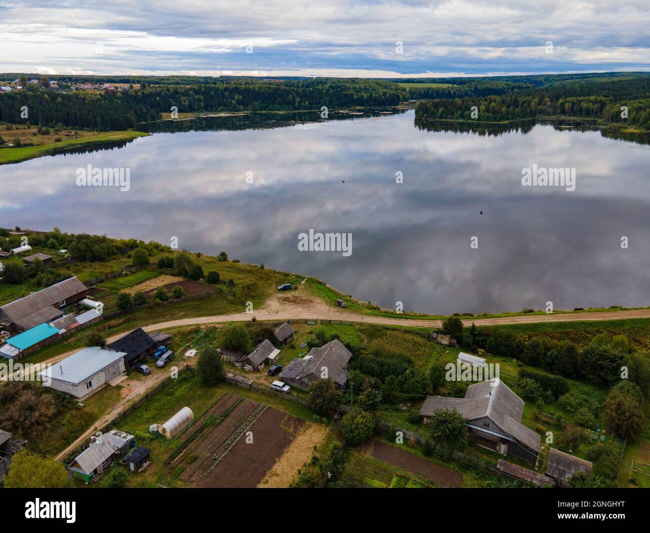 Amazing landscape of calm lake near village Stock Photo - Alamy Amazing landscape of calm lake near village Stock Photo - Alamy