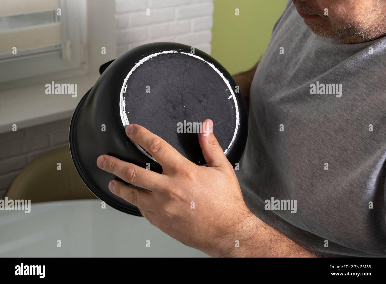 the non-stick coating of the pan is damaged Stock Photo - Alamy