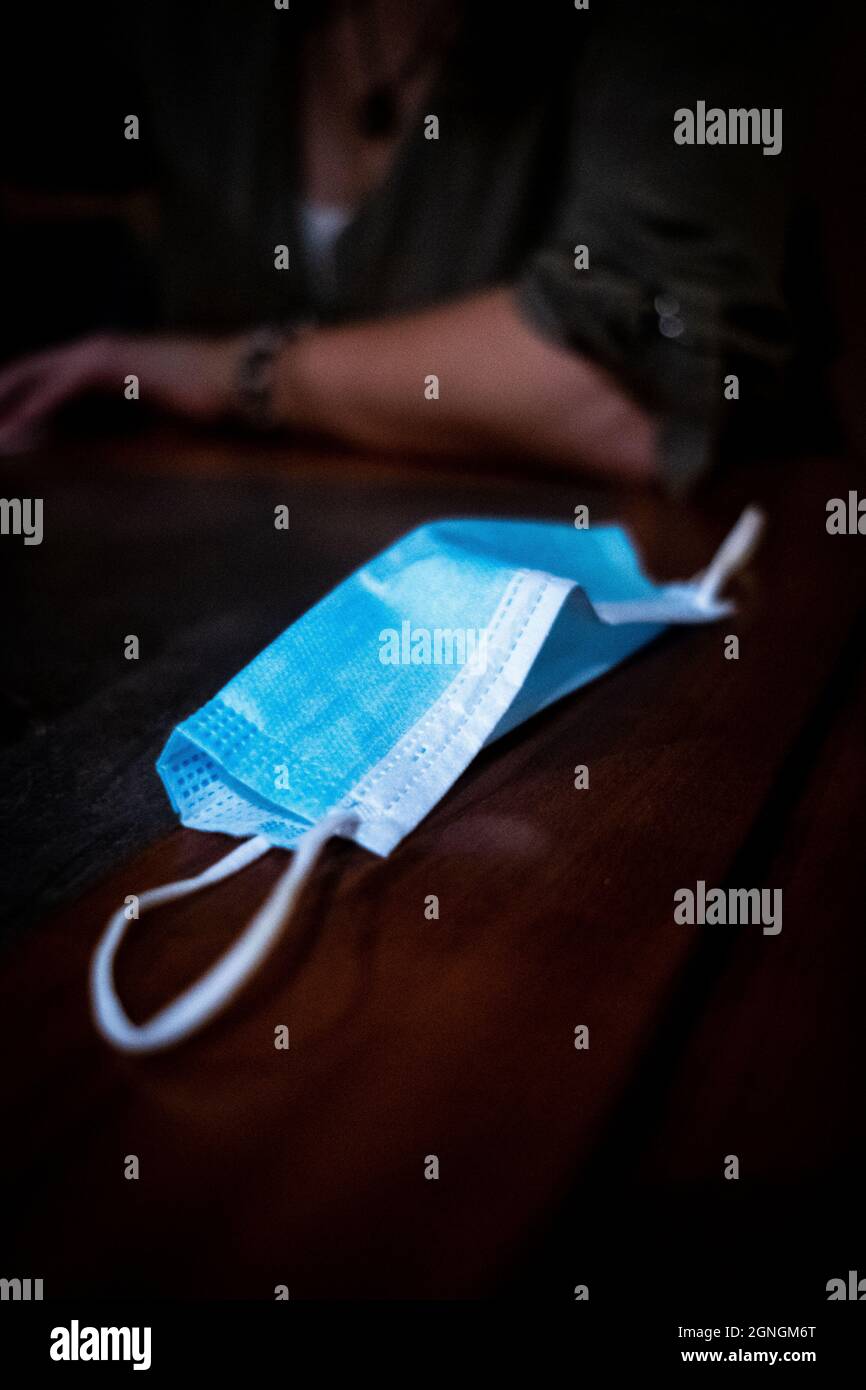Mask lying on a table. Covid-19 crisis. Dinan, France Stock Photo - Alamy