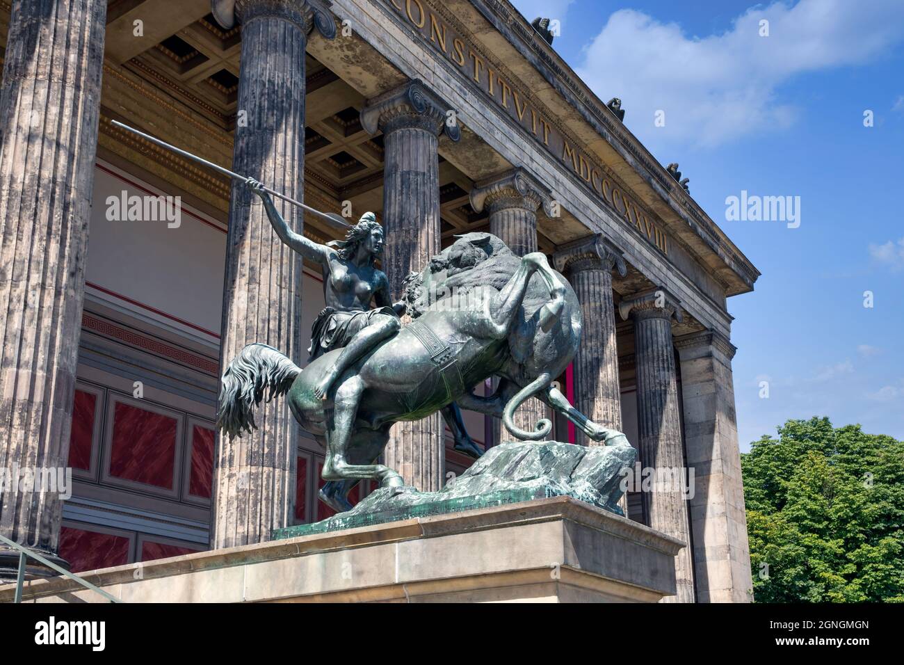 Facade with iconic pillars and statue lion fighter Altes Museum in ...
