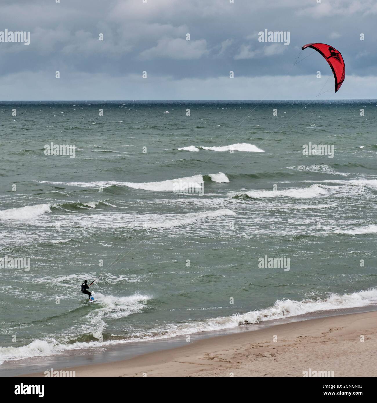 Kitesurfer is riding the waves hi-res stock photography and images - Alamy