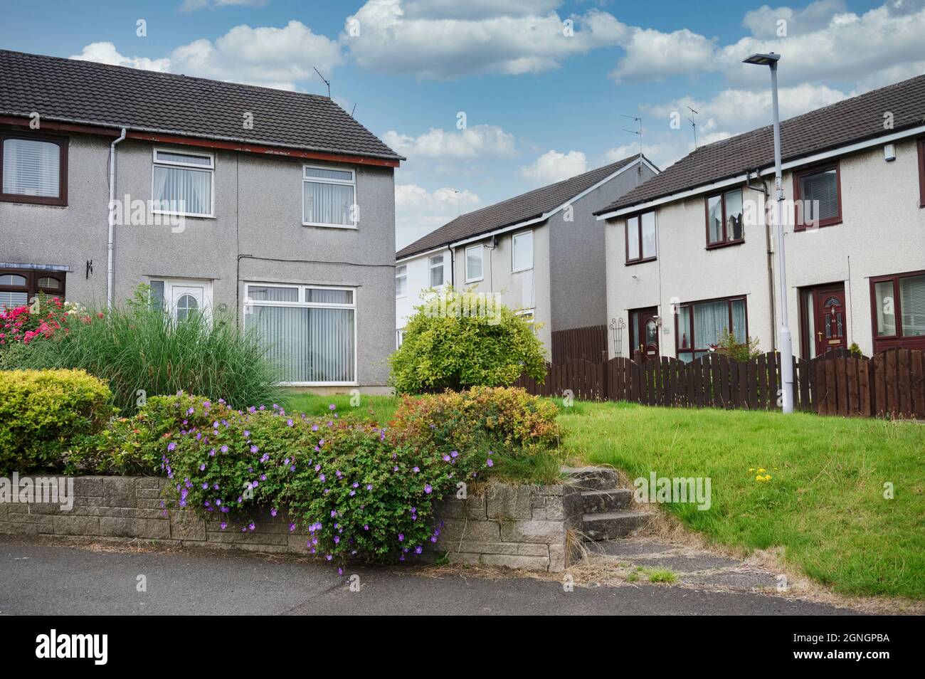 Derelict council house in poor housing estate slum with many social ...