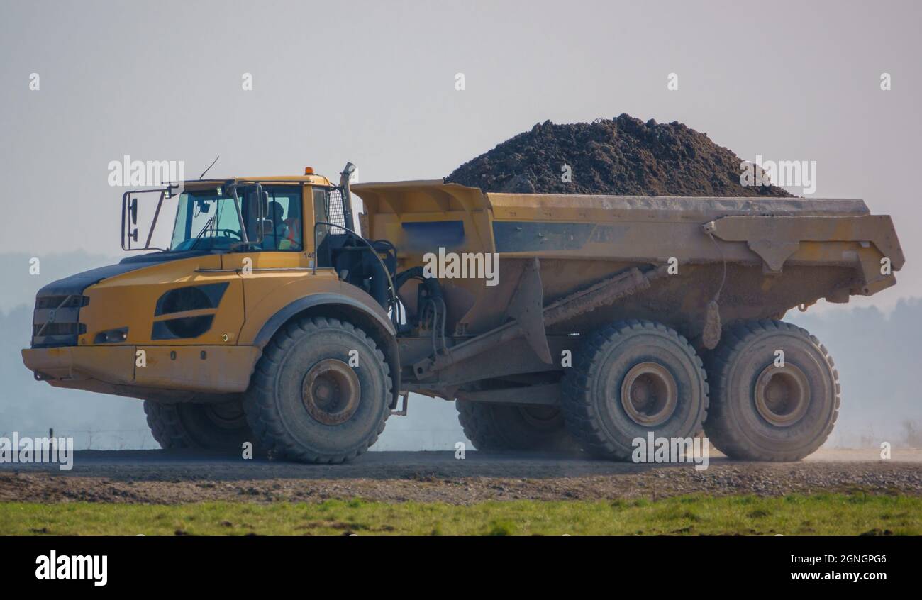 yellow Volvo A40E articulated dump truck earth mover with a full 25 ...