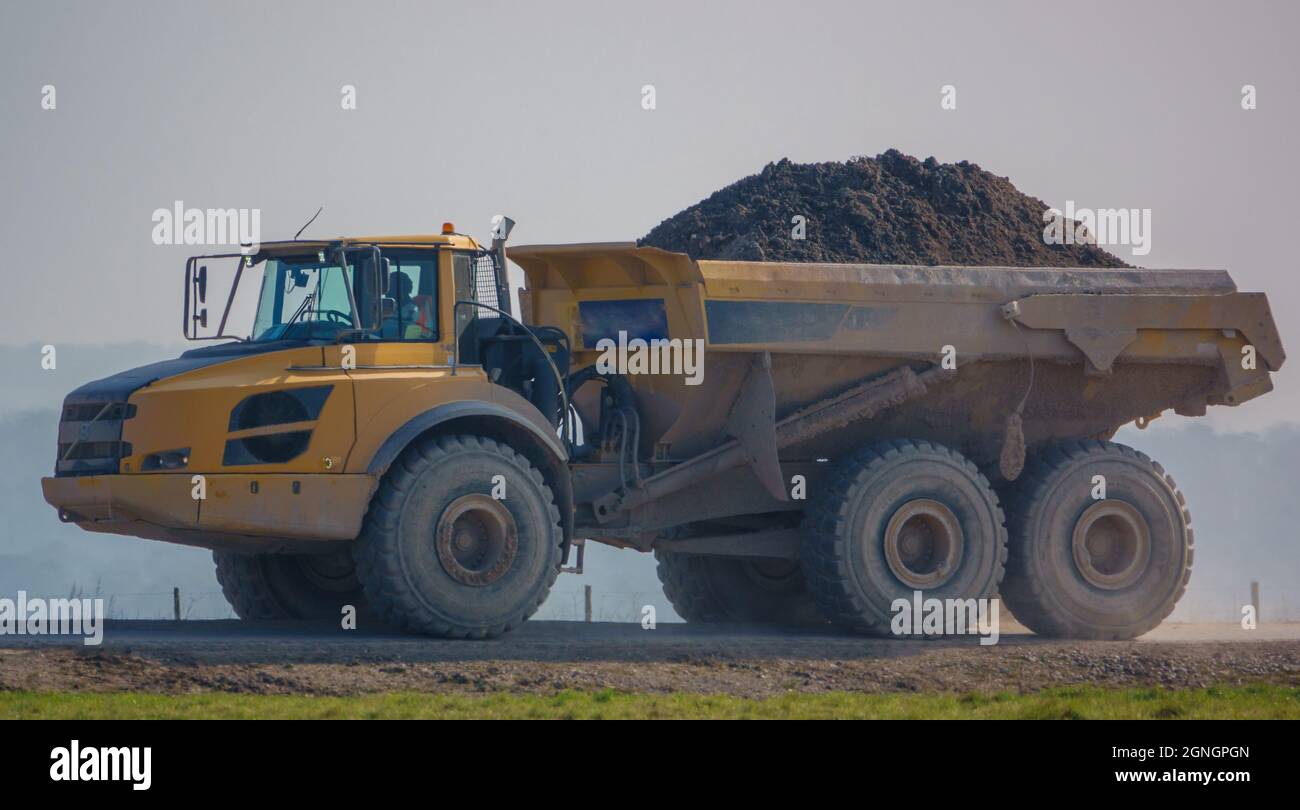 yellow Volvo A40E articulated dump truck earth mover with a full 25 ...