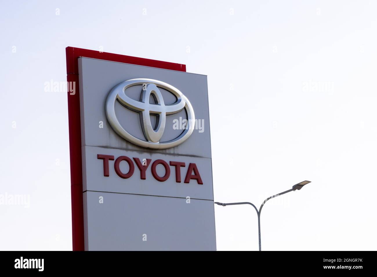 Toyota car dealers point. Big advertising board with Toyota logotype ...