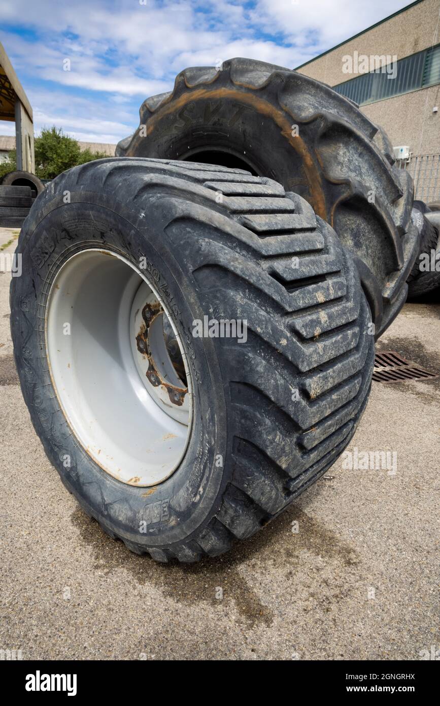 Stack of old used tires of different sizes and types in abandoned scrap ...
